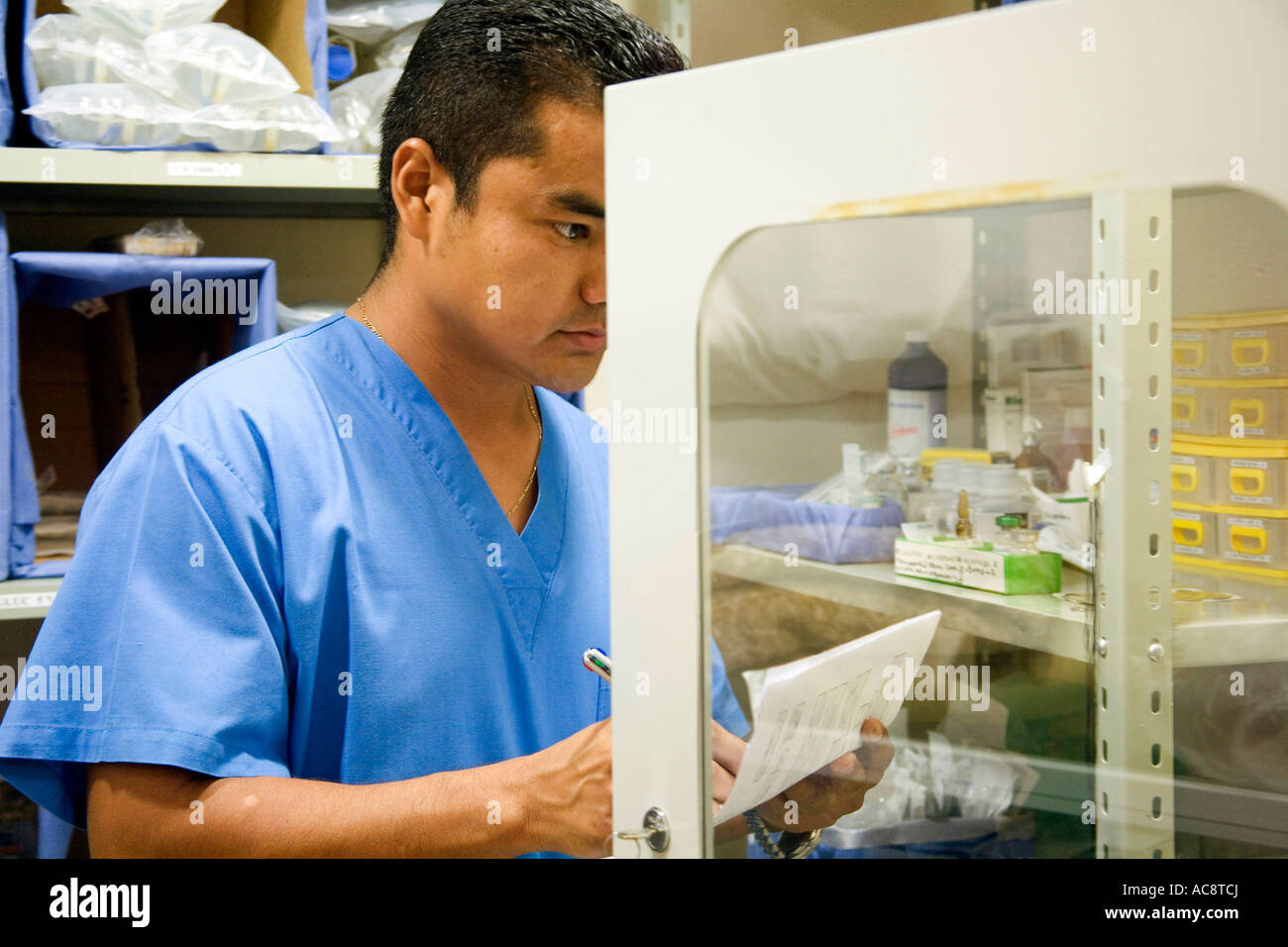 Male nurse making a list of medicine Stock Photo - Alamy
