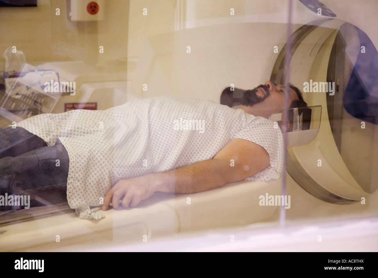 Patient lying on cat scan hi-res stock photography and images - Alamy