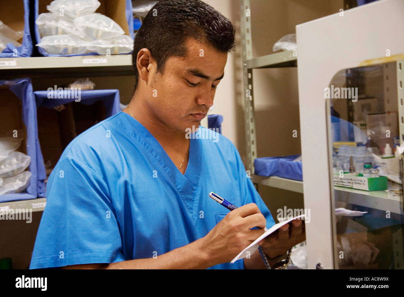 Male nurse making a list of medicine Stock Photo - Alamy