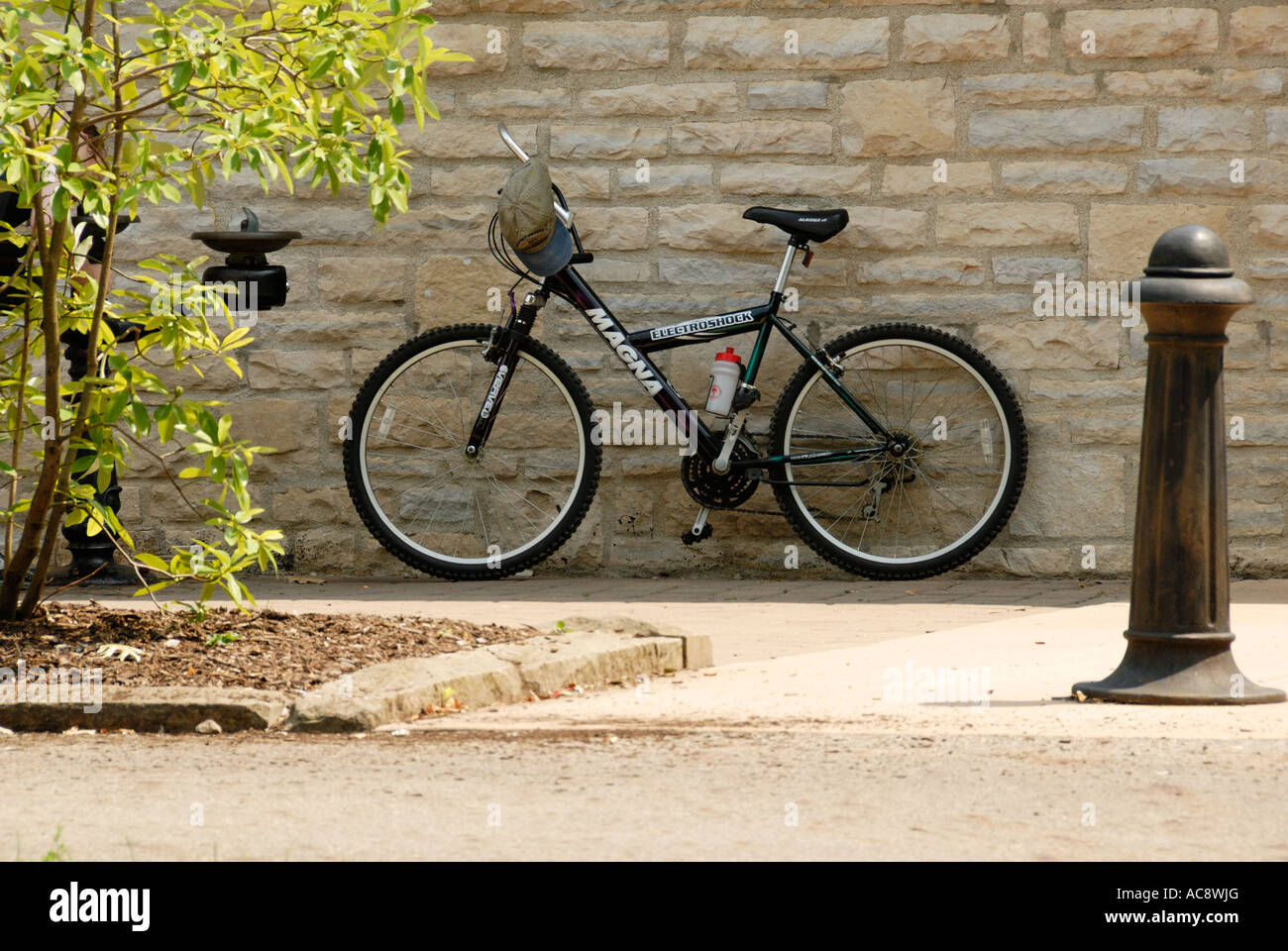 Bicycle against wall Stock Photo - Alamy