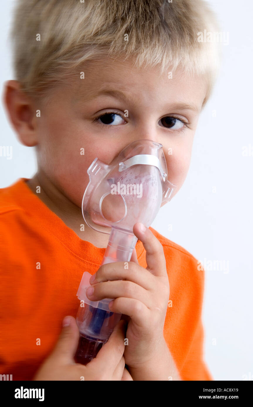 Boy using breathing machine Stock Photo - Alamy