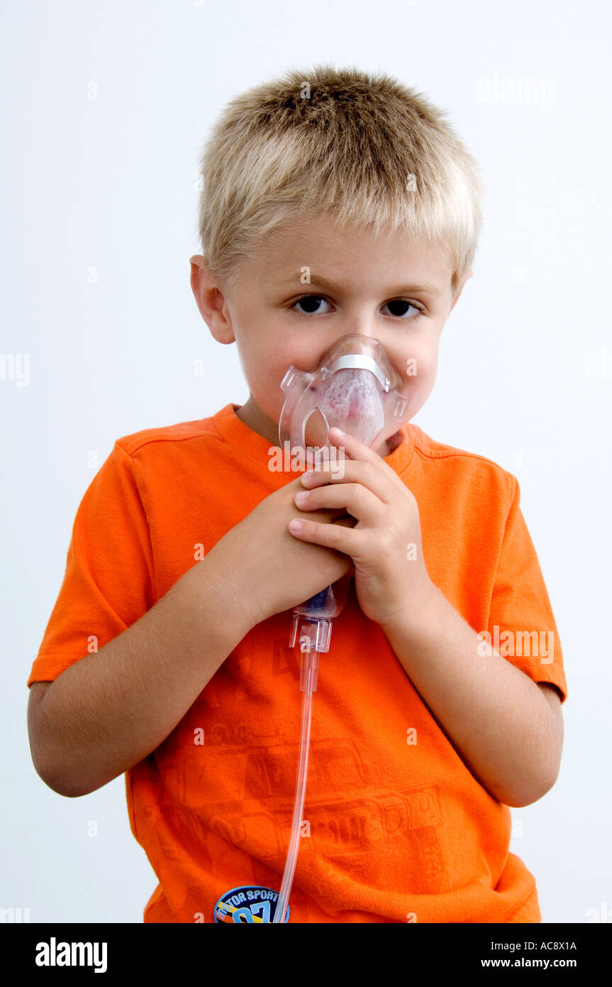 Boy using breathing machine Stock Photo - Alamy