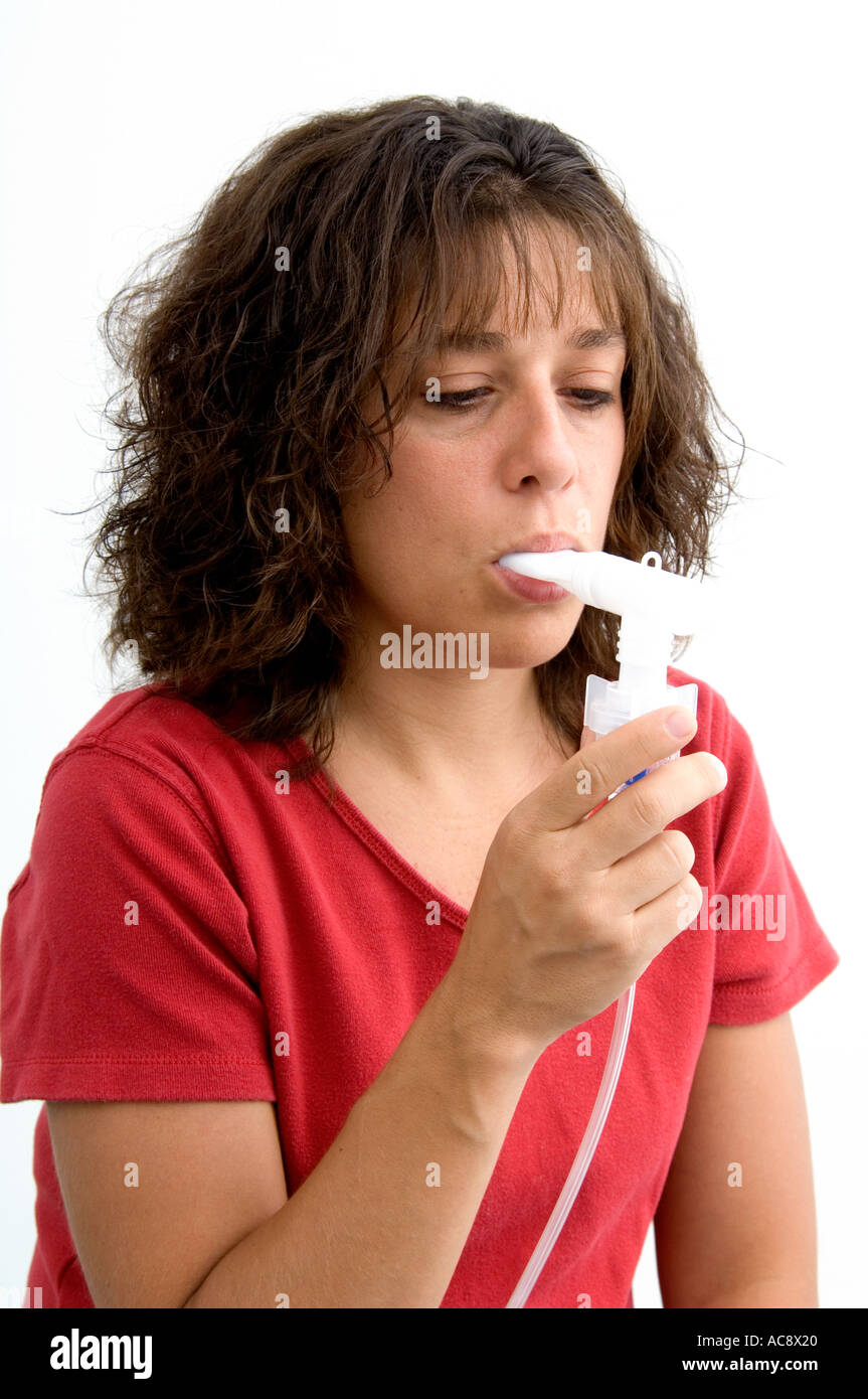 Woman using breathing machine Stock Photo - Alamy