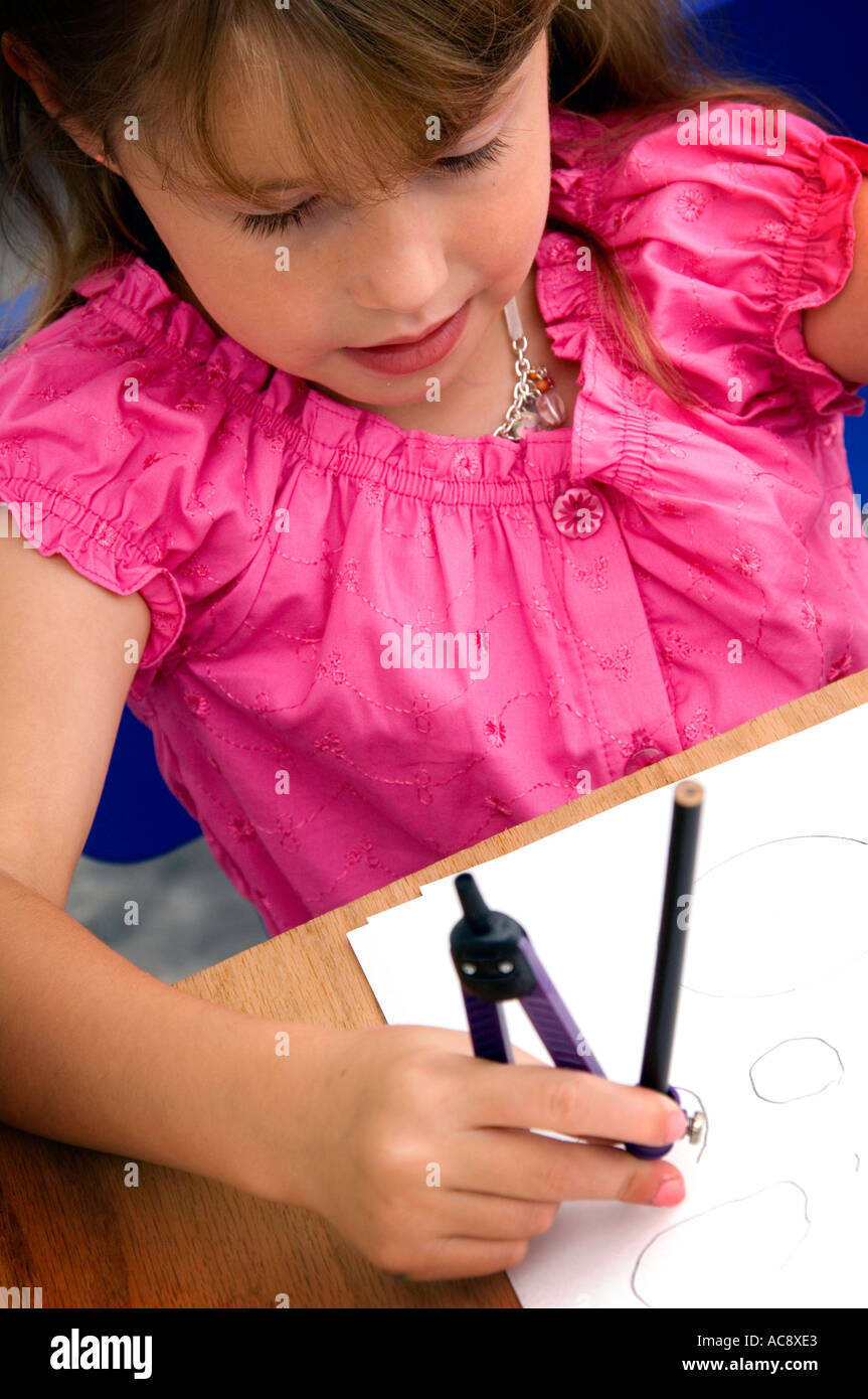 Girl using compass Stock Photo - Alamy