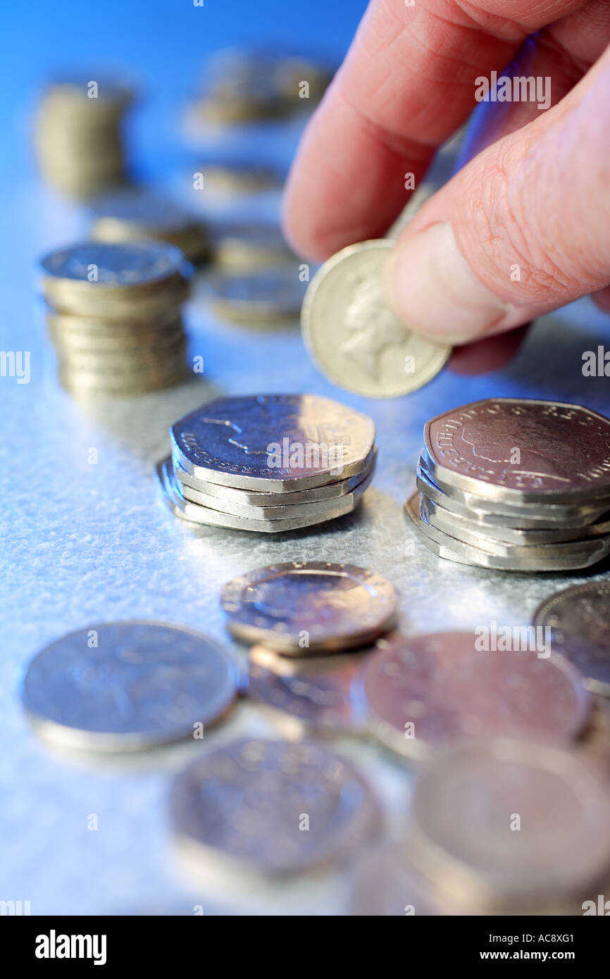 Hand sorting coins hi-res stock photography and images - Alamy