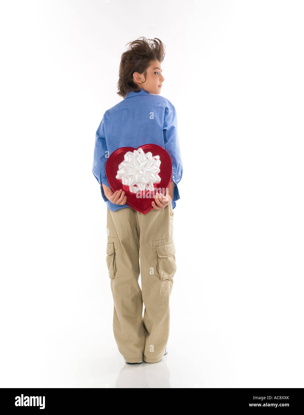 Boy looking behind rear view hi-res stock photography and images - Alamy