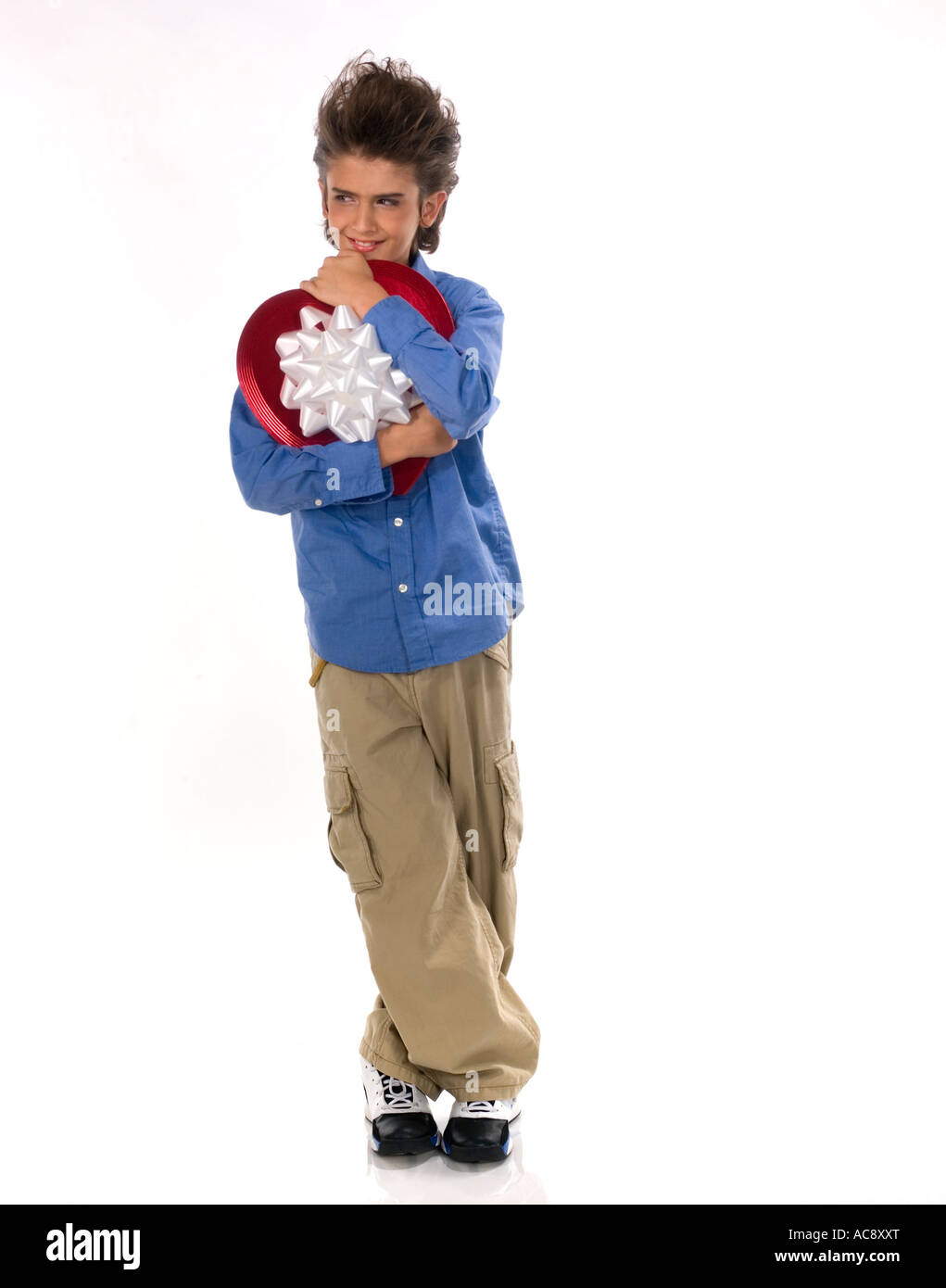 Boy holding a heart shape valentine and smiling Stock Photo - Alamy