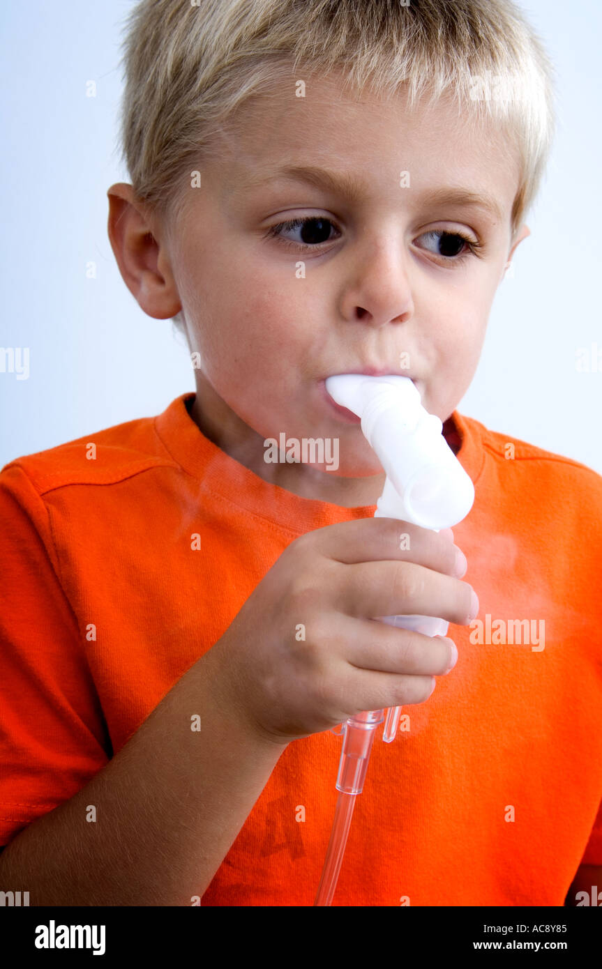 Boy using breathing machine Stock Photo - Alamy