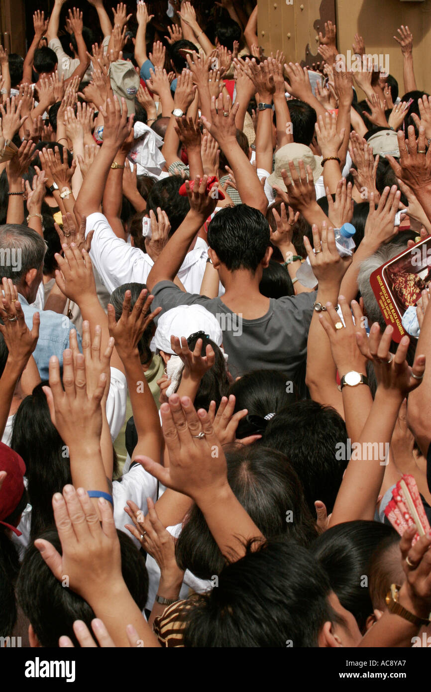 Congregation raising hands, Quiapo, Manila, Philippines Stock Photo - Alamy