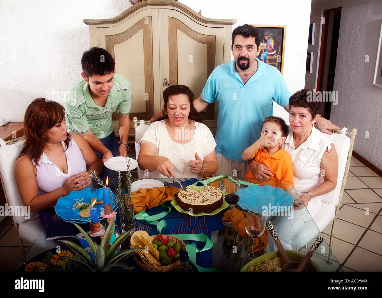 Family at the dining table Stock Photo - Alamy