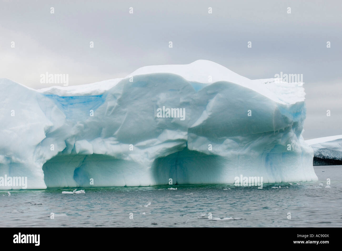 Iceberg floating on water Stock Photo - Alamy