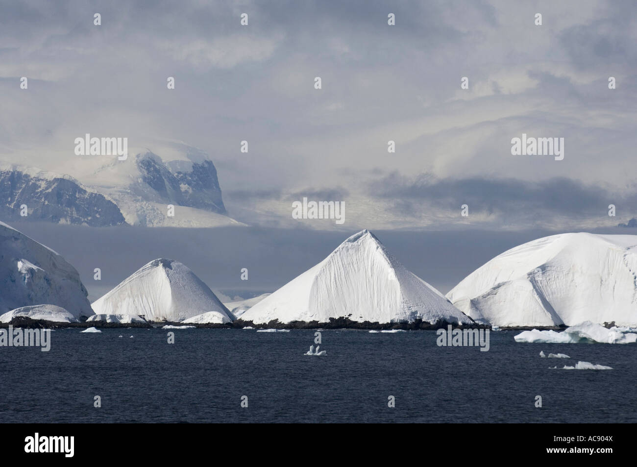 Iceberg floating on water Stock Photo - Alamy