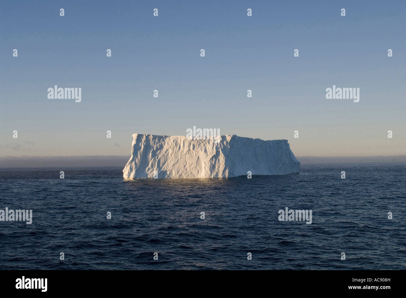 Iceberg floating on water Stock Photo - Alamy