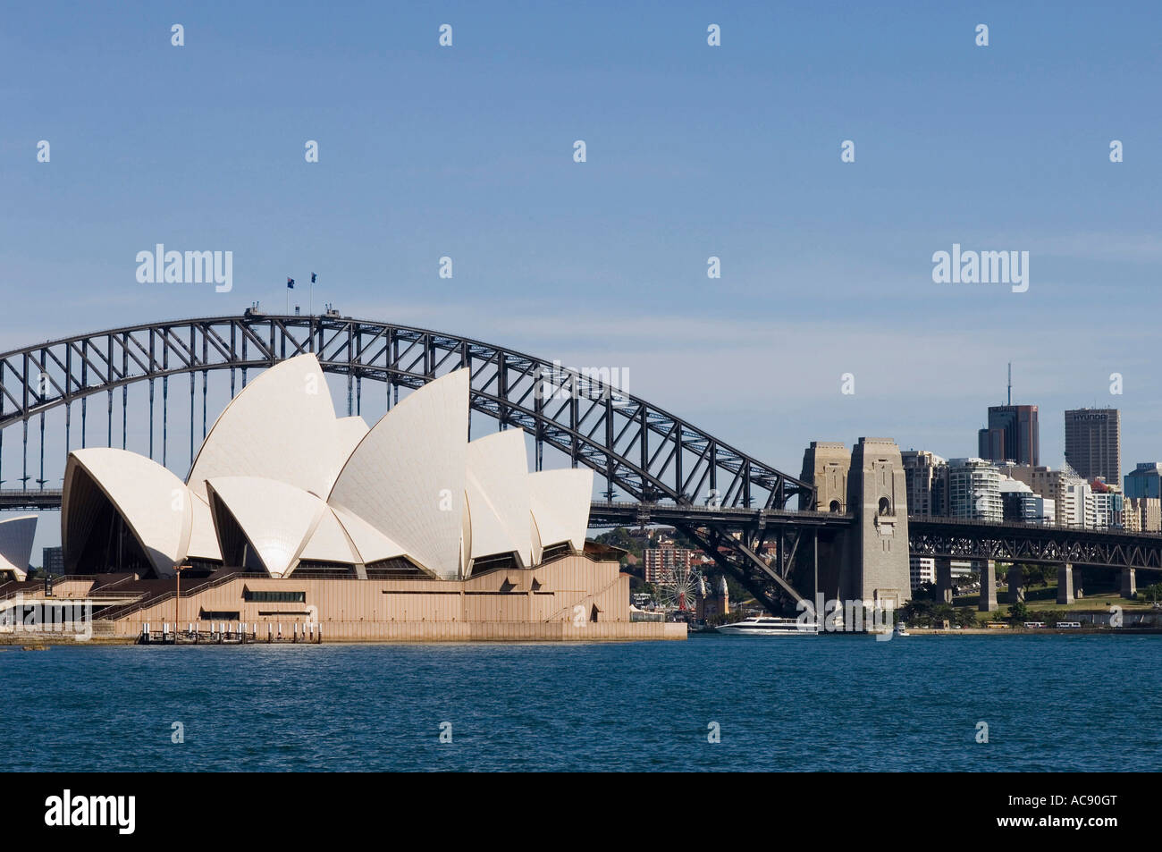Opera house on the waterfront near a bridge, Sydney Opera House, Sydney ...