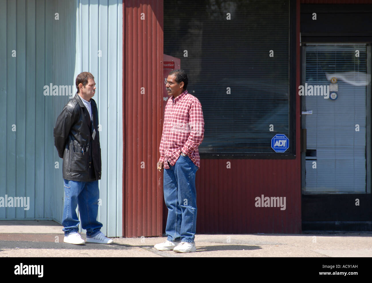 Conversation on the street Stock Photo - Alamy