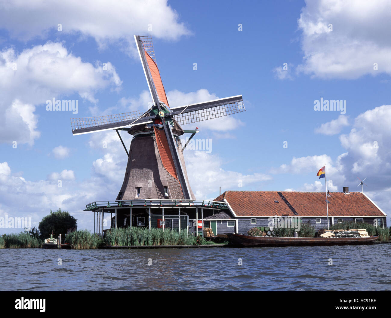 Windmill by water Stock Photo - Alamy