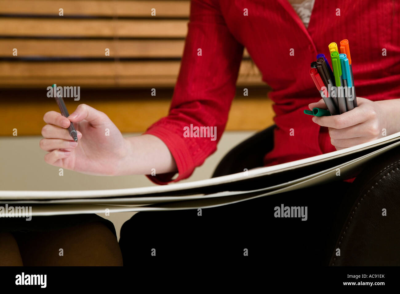Mid section view of a businesswoman drawing on a sketch pad Stock Photo ...
