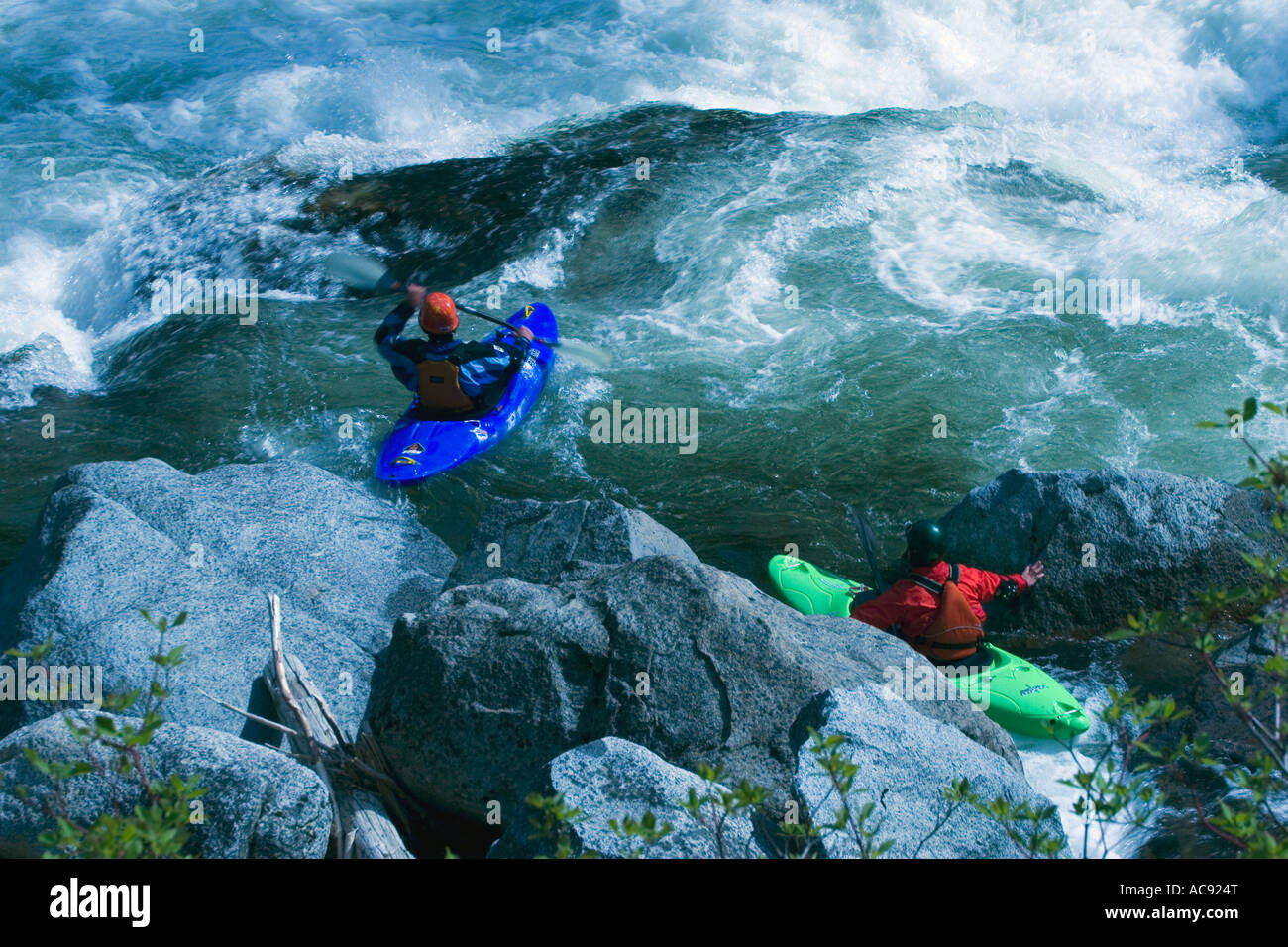 Two kayakers attack a problem along Icicle Creek in Icicle Canyon near ...
