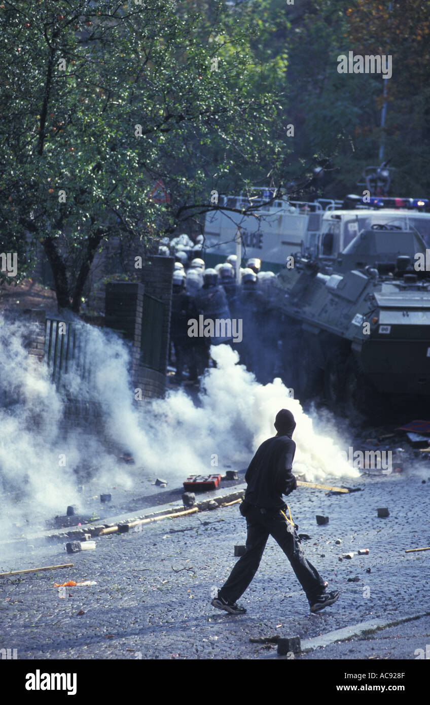 protesters hurl stones at Czech riot police in an anti globalisation ...
