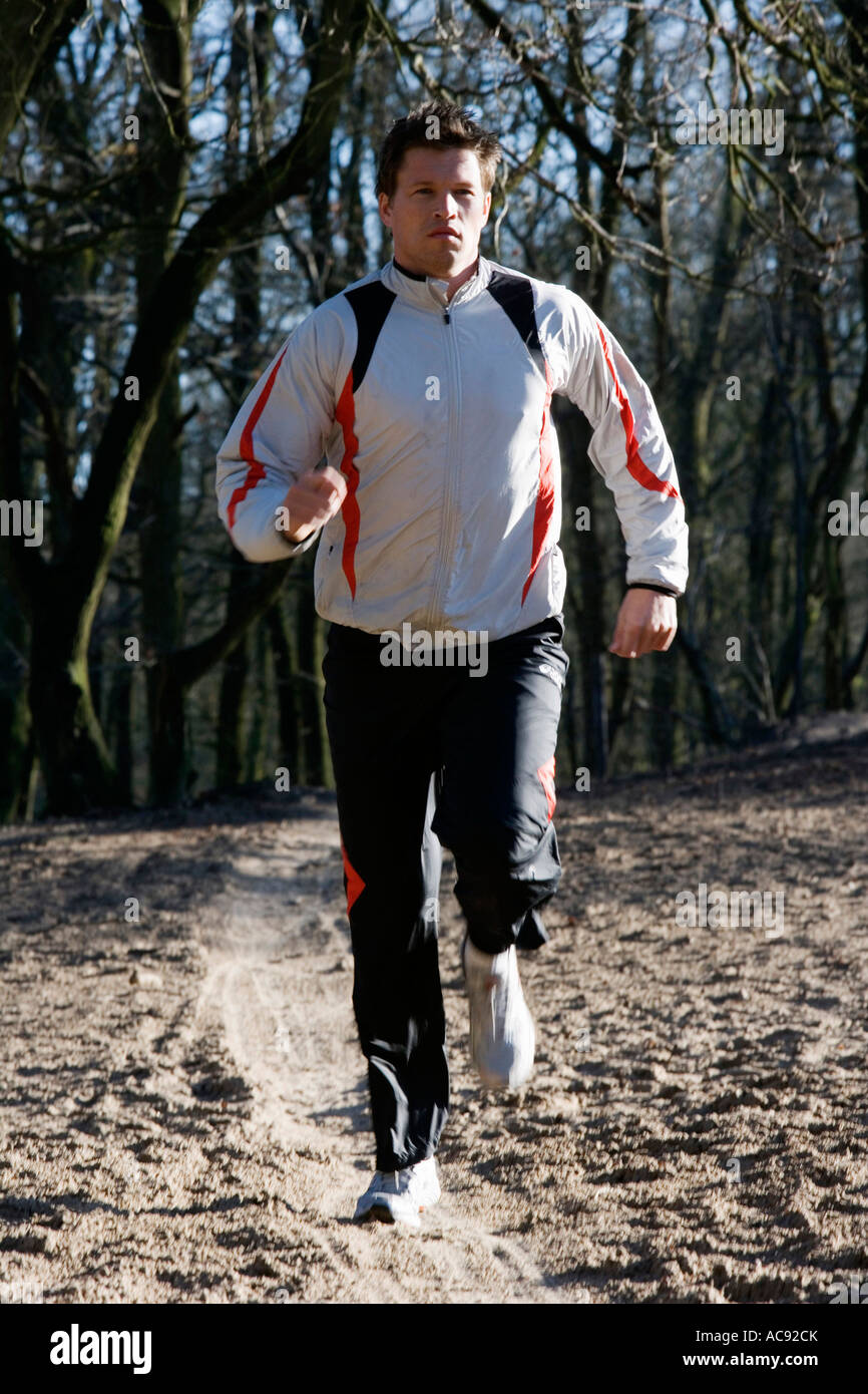 Mid adult man running Stock Photo - Alamy