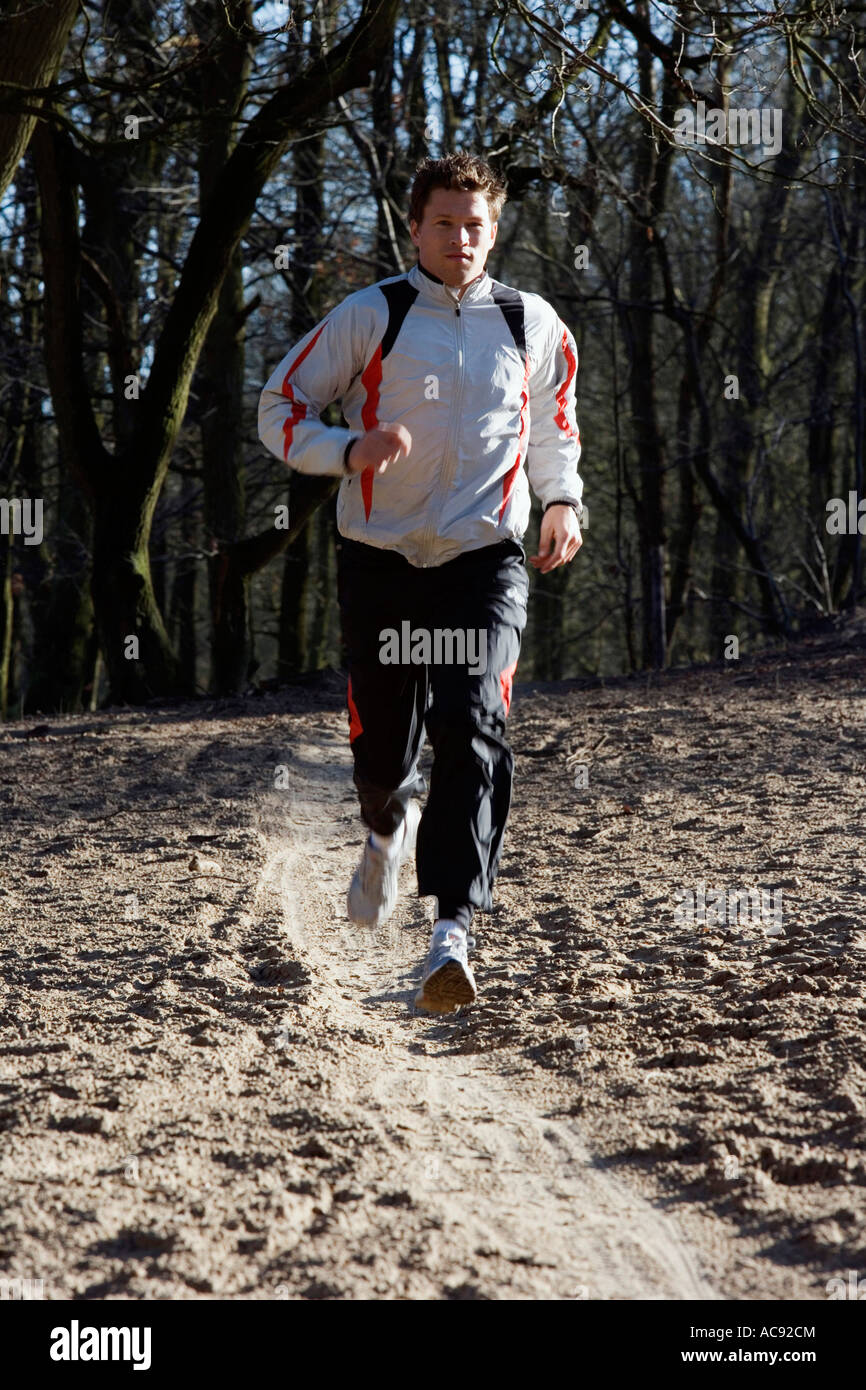 Mid adult man running Stock Photo - Alamy