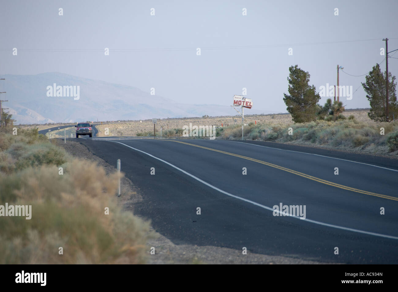 Asphalt road fading into the distance Stock Photo - Alamy