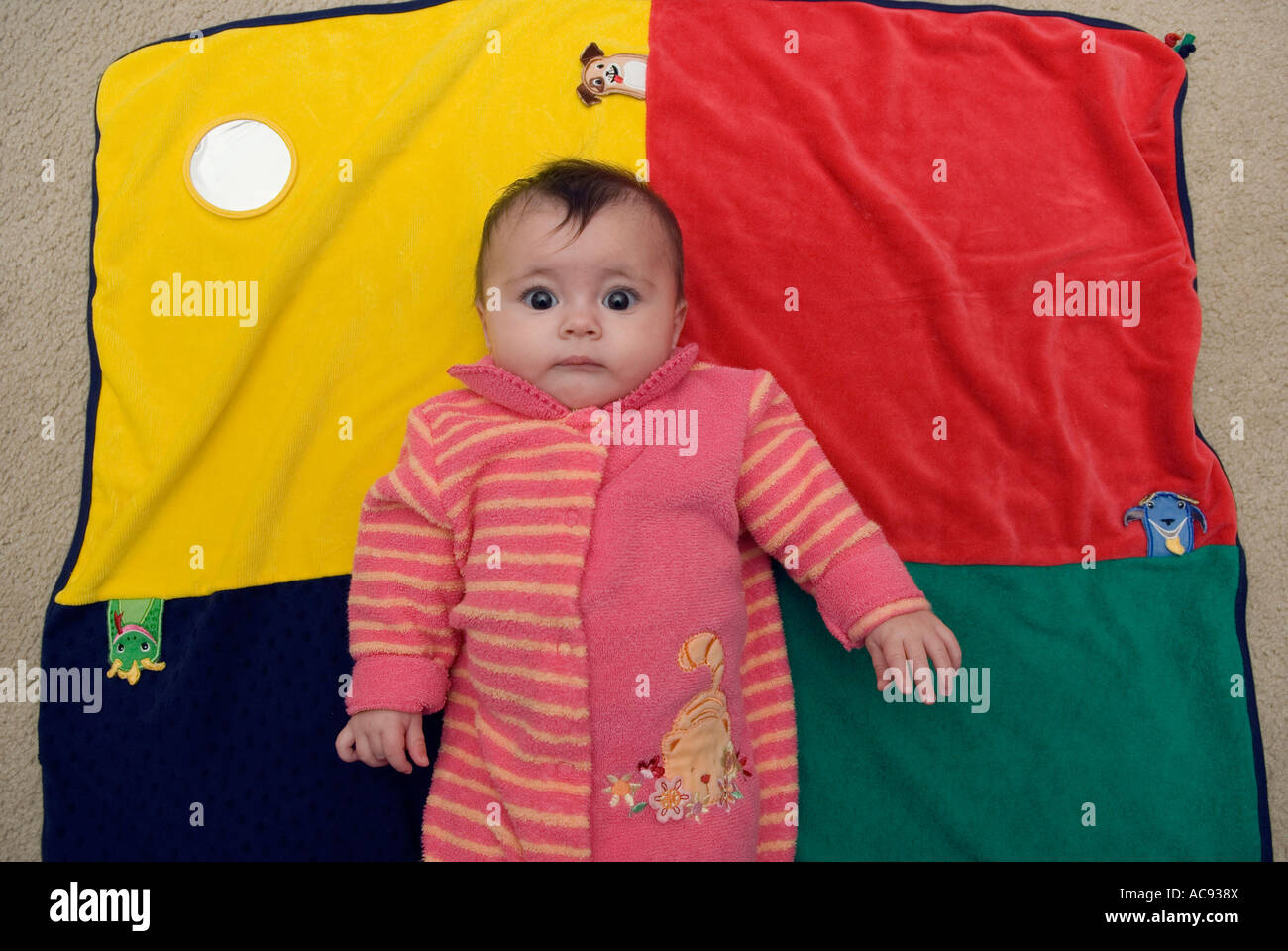High angle view of a baby girl lying on a blanket Stock Photo - Alamy