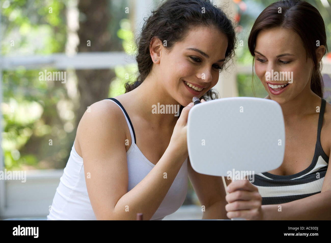 Teenage girls applying make-up Stock Photo - Alamy