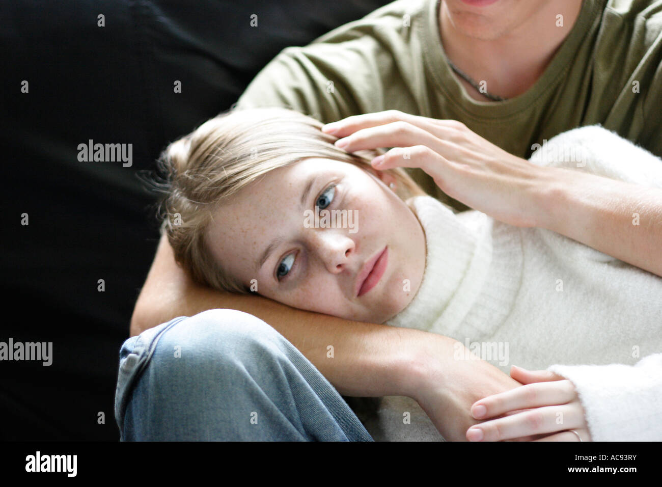 Young woman being comforted by partner Stock Photo - Alamy