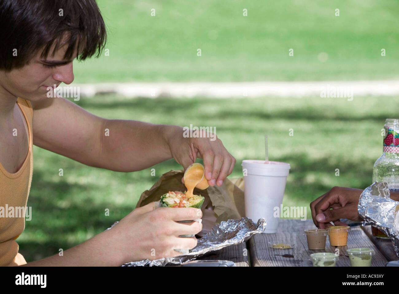 Close-up of a young man eating Stock Photo - Alamy