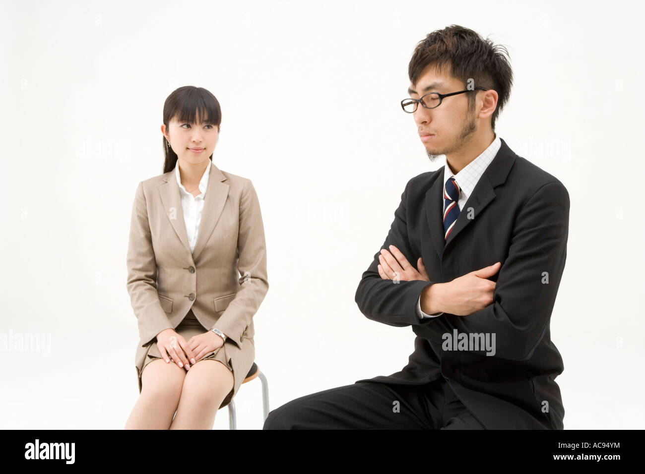 Two business people sitting Stock Photo - Alamy