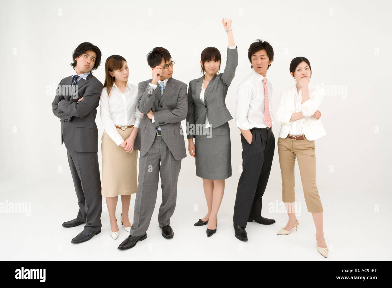 Businesswoman standing out from the group Stock Photo - Alamy