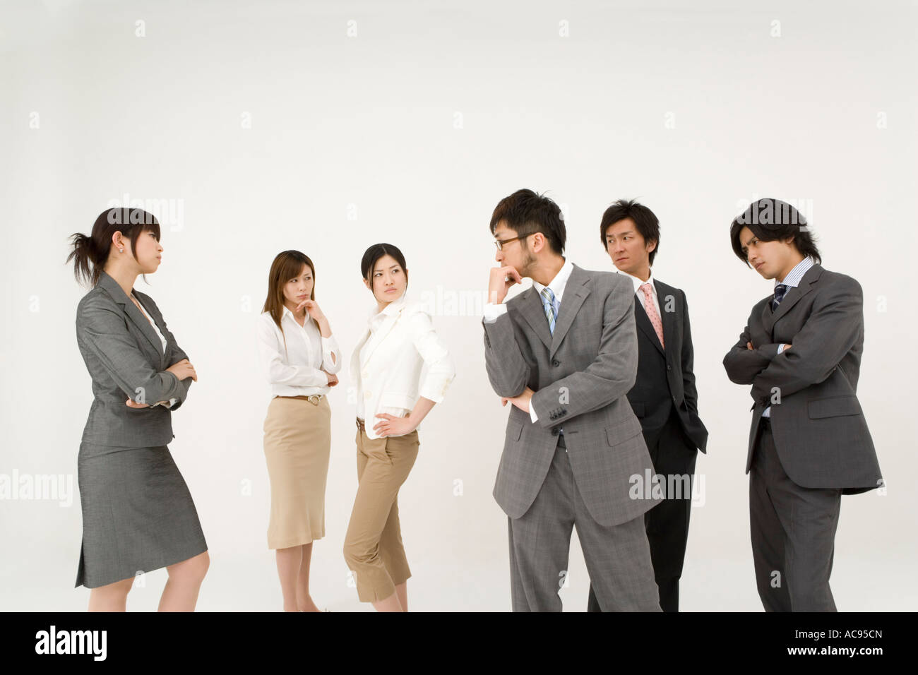 Business people glaring at each other Stock Photo - Alamy