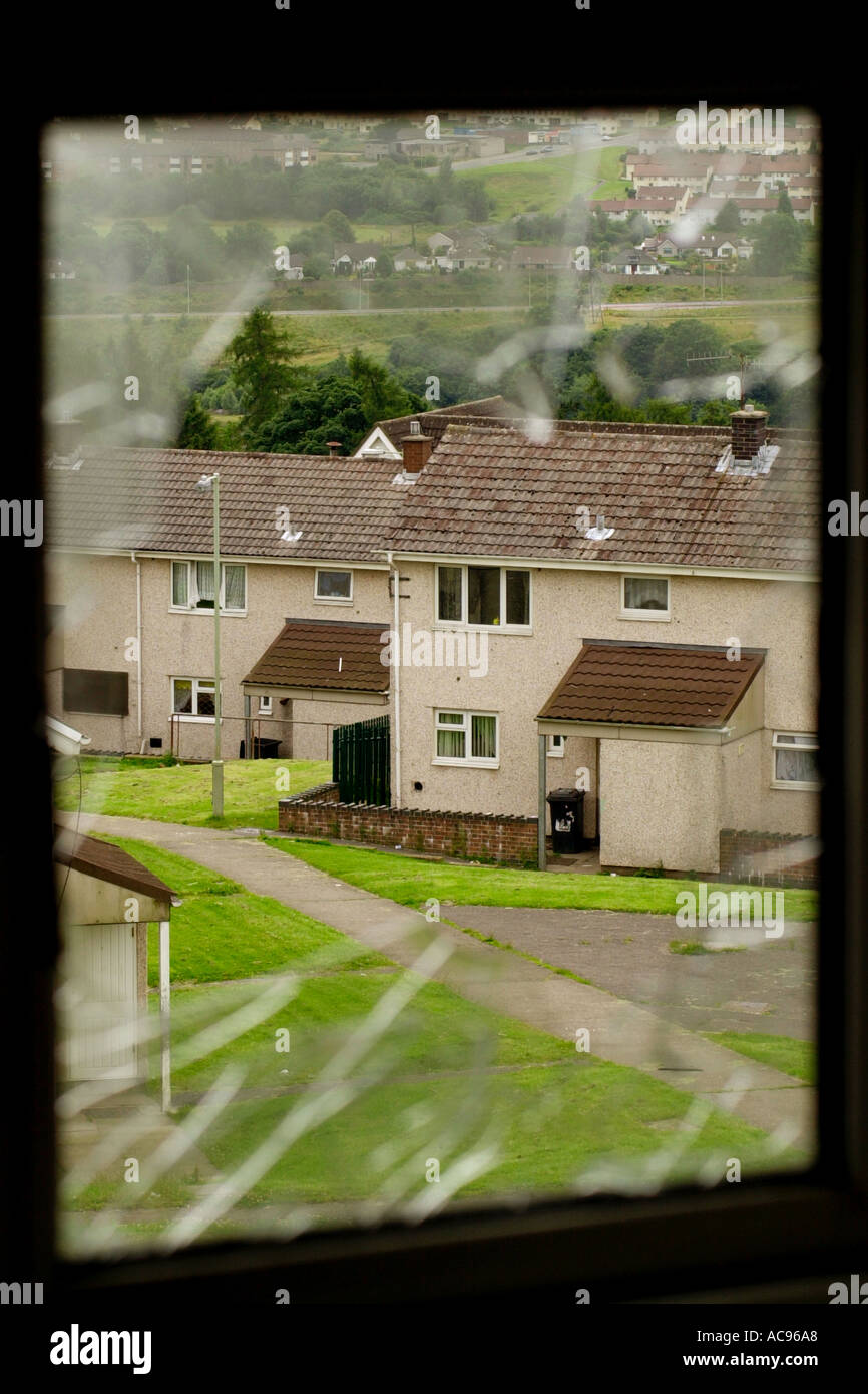 View thru smashed window of empty derelict house on the Gurnos Estate ...