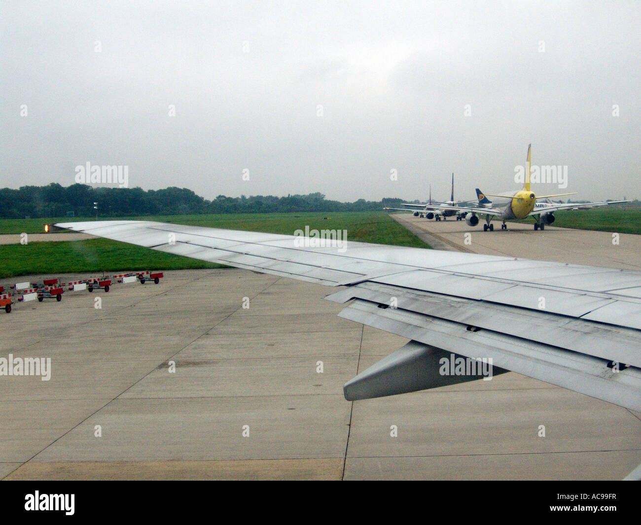 Aeroplanes wait on the runway to take off during summer delays Stock ...