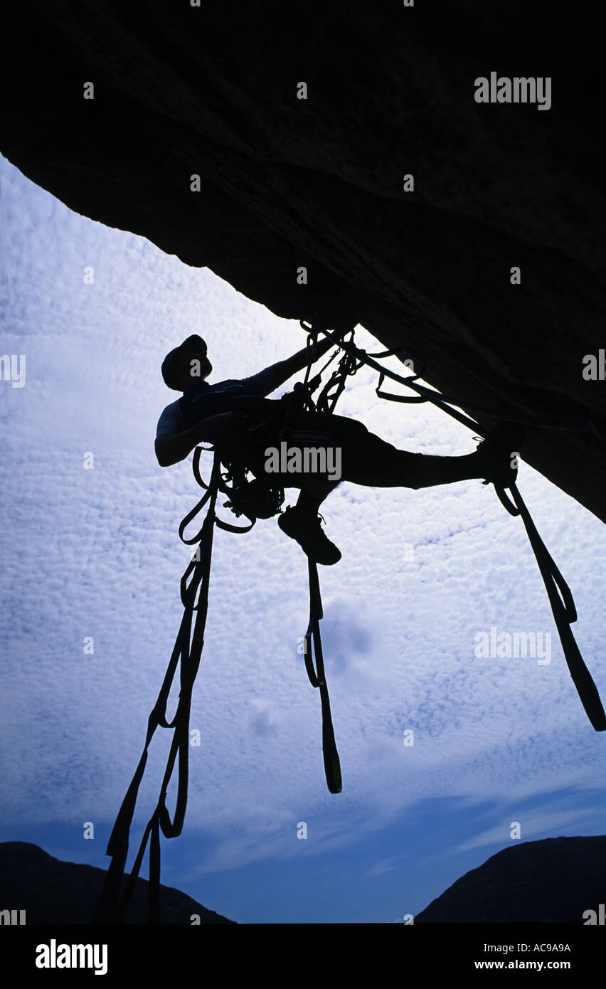 A climber scaling an overhanging cliff Stock Photo - Alamy