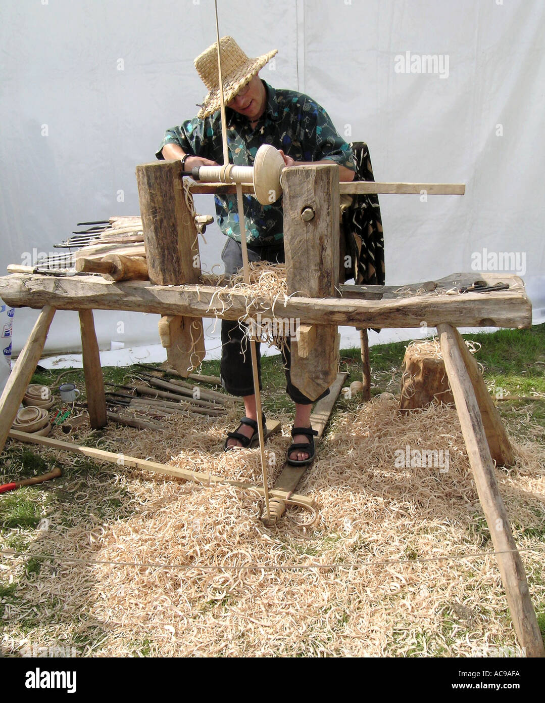 Furniture maker demonstrating a foot operated lathe at Art in Action ...