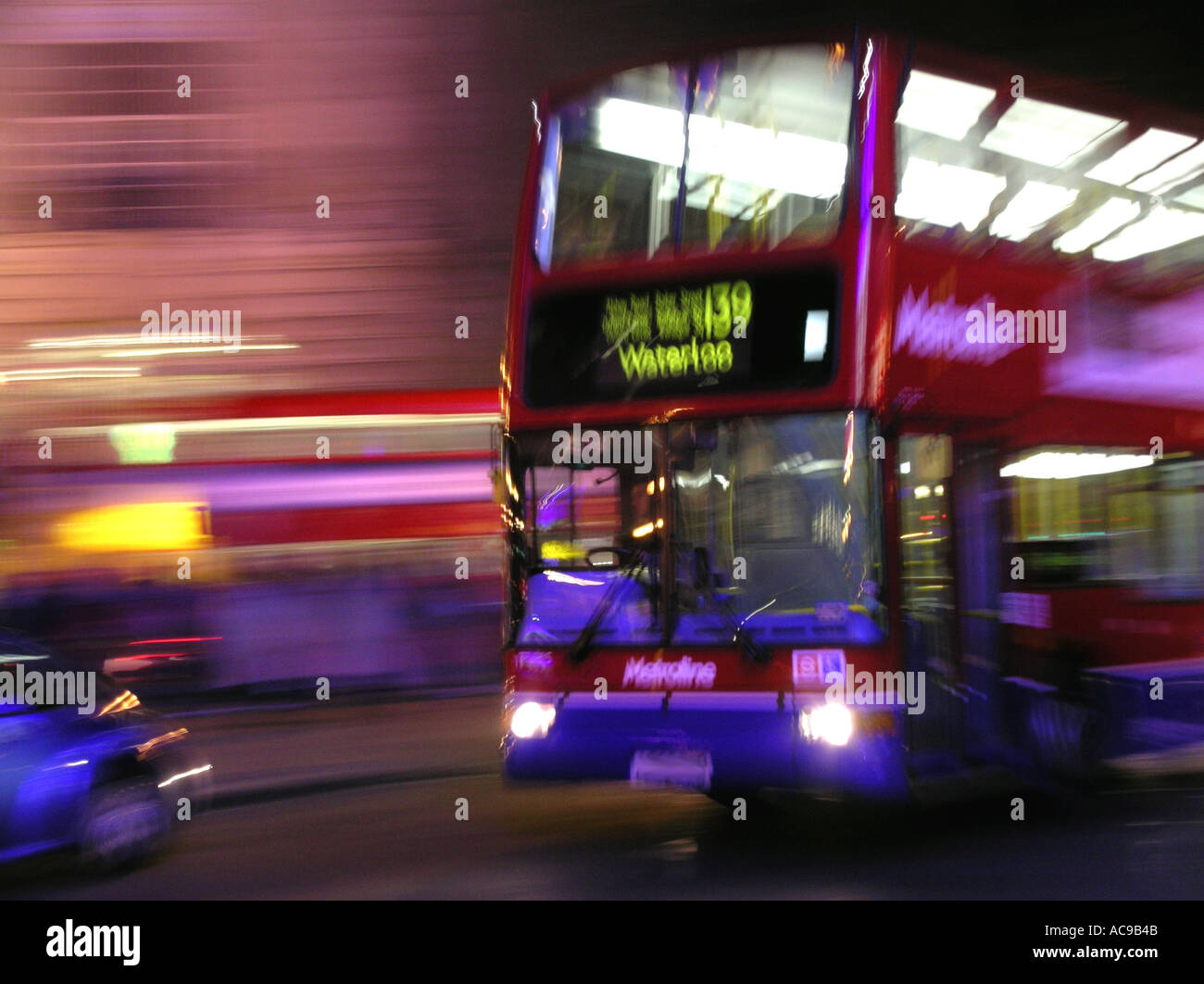 Blur of a red double decker bus at night in London England UK Britain ...