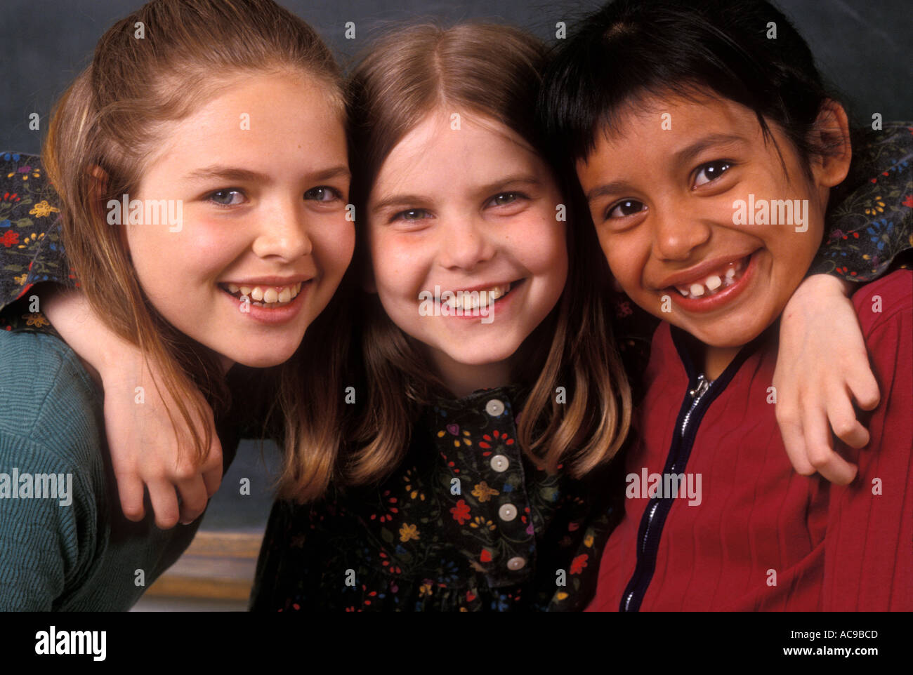 Portrait of three elementary school girls Stock Photo - Alamy