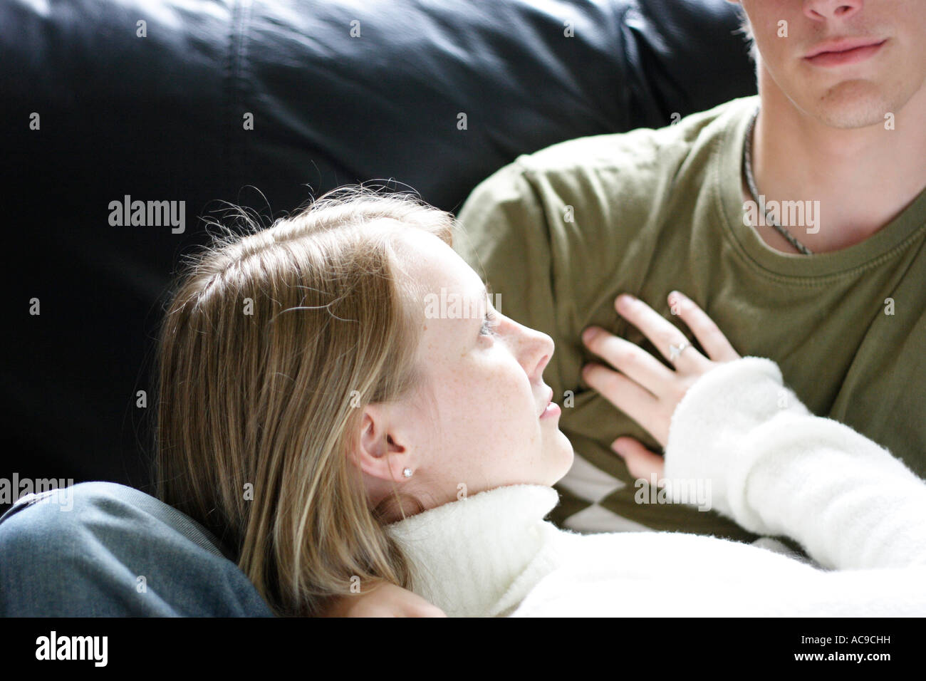 Young woman comforting partner Stock Photo - Alamy