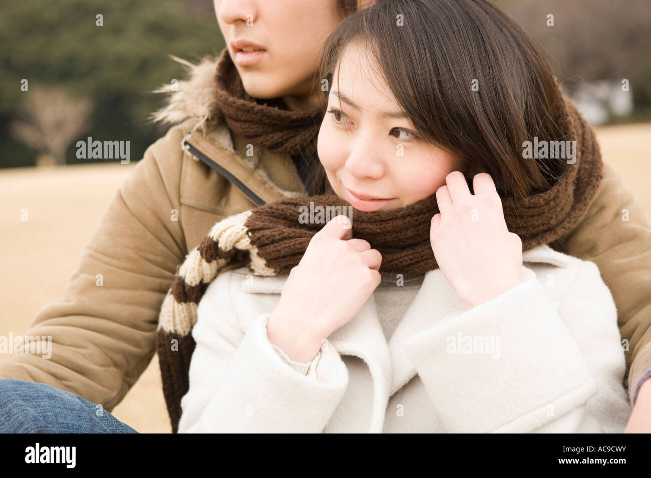Young couple sharing scarf hi-res stock photography and images - Alamy