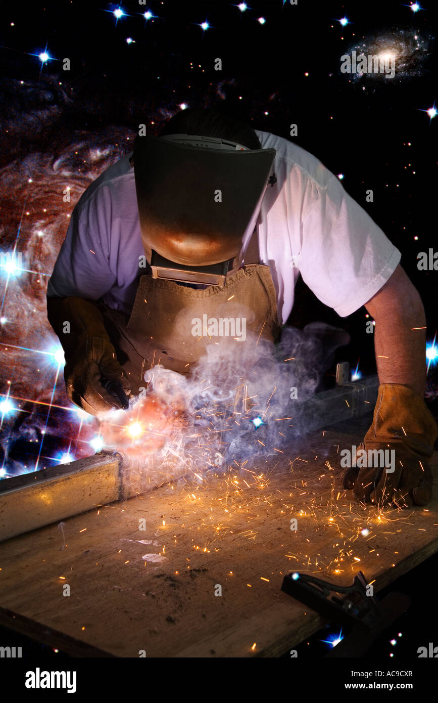 Welder at Work Against Starfield Stock Photo - Alamy