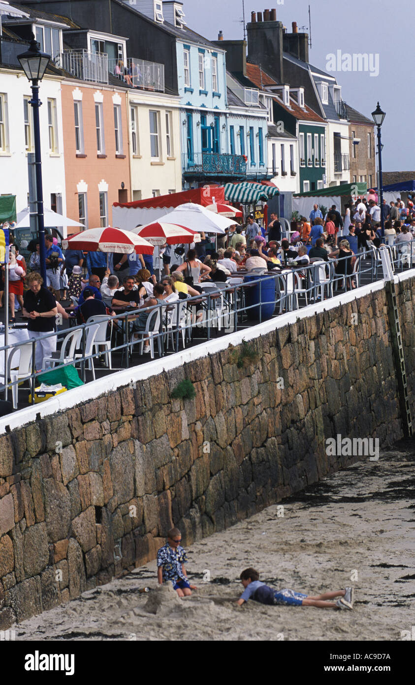 Gorey Jersey The Channel islands. Evening tourists on the quayside pubs ...