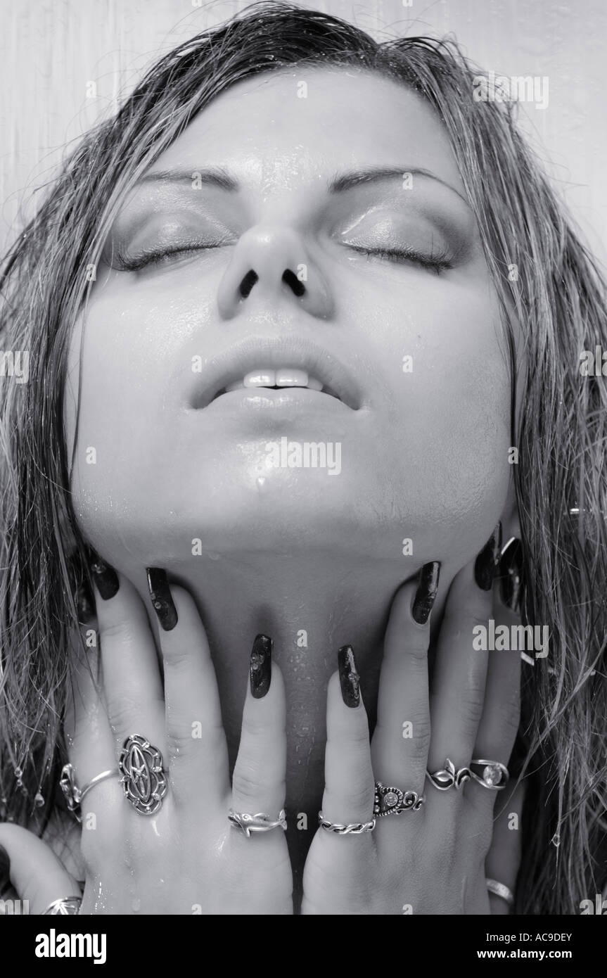 Beautiful woman face under rain water Face beauty wet refreshing shower ...