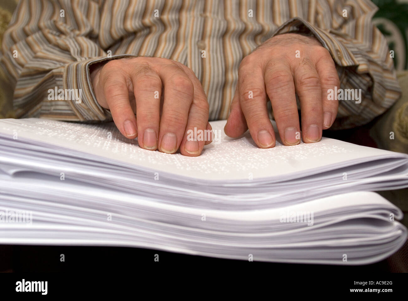 Blind man reading braille London UK Stock Photo - Alamy