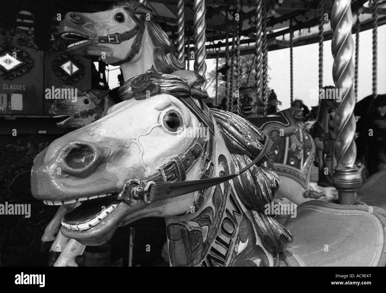 Wild ride on carousel horses at the fairground Stock Photo - Alamy
