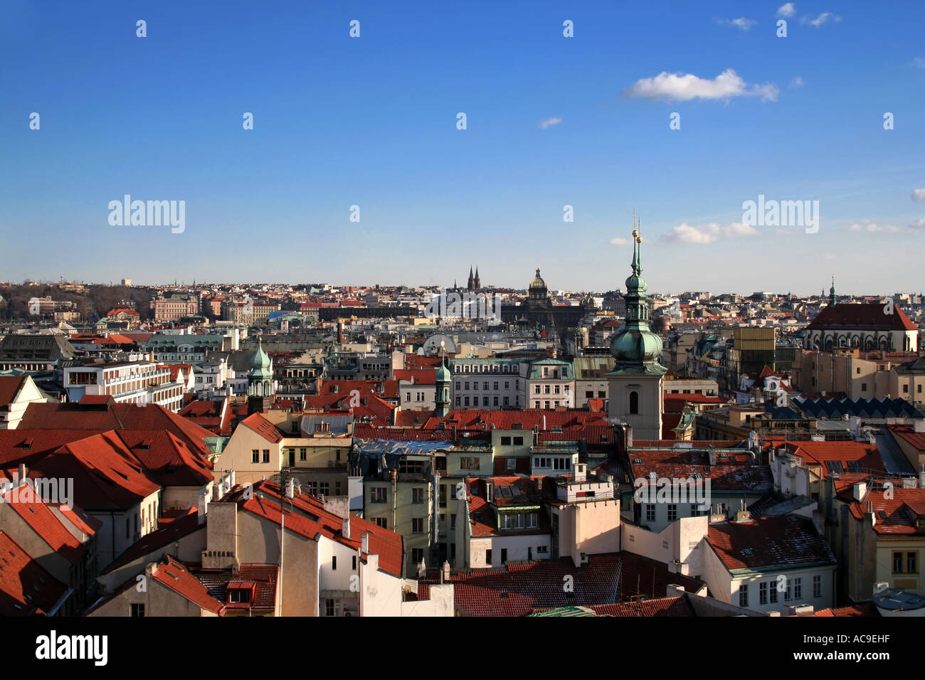 Panoramic view of Prague cityscape with red rooftops, historic ...