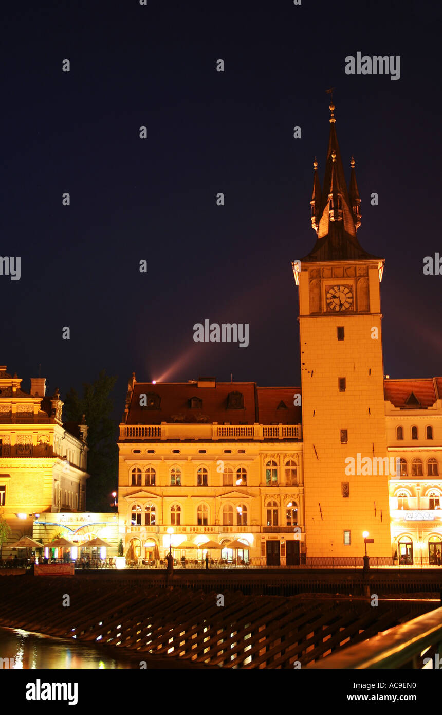Staromestska water tower and nearby buildings illuminated at night near ...