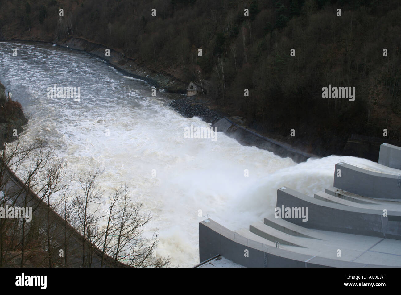 A powerful dam releasing water into a river in the Czech Republic. A ...