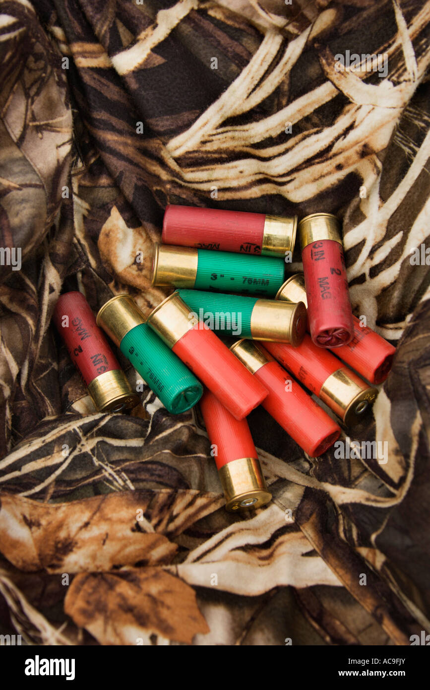 Still life shot of shotgun shells against camouflage clothing Stock ...